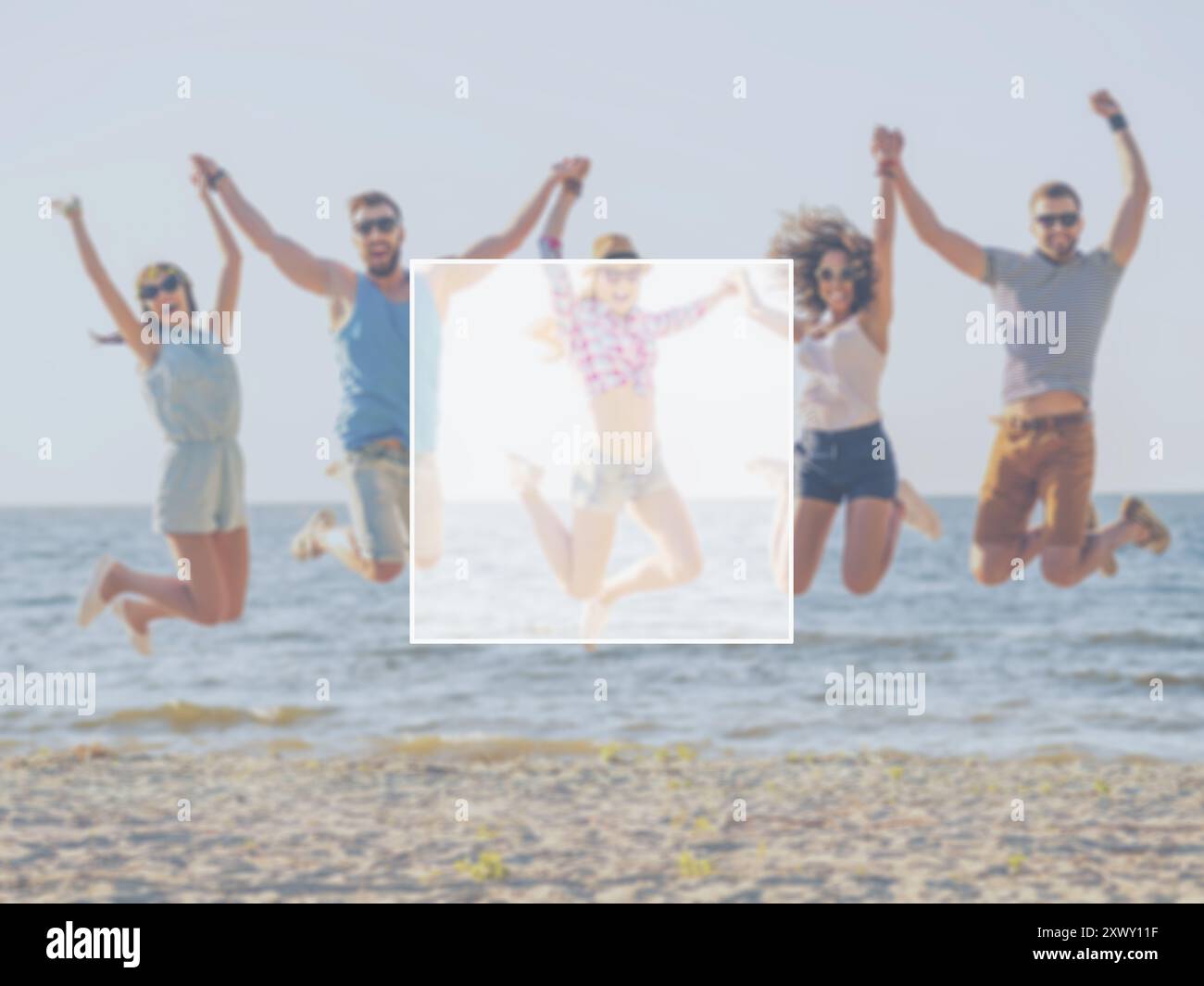 Fun with friends. Group of happy young people holding hands and jumping ...