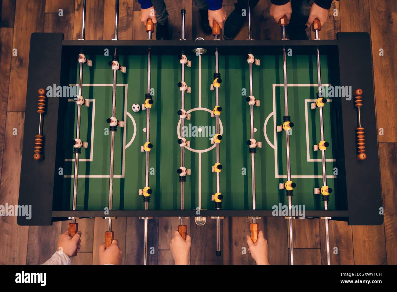 Foosball game. Top view of foosball table on the wooden floor Stock ...