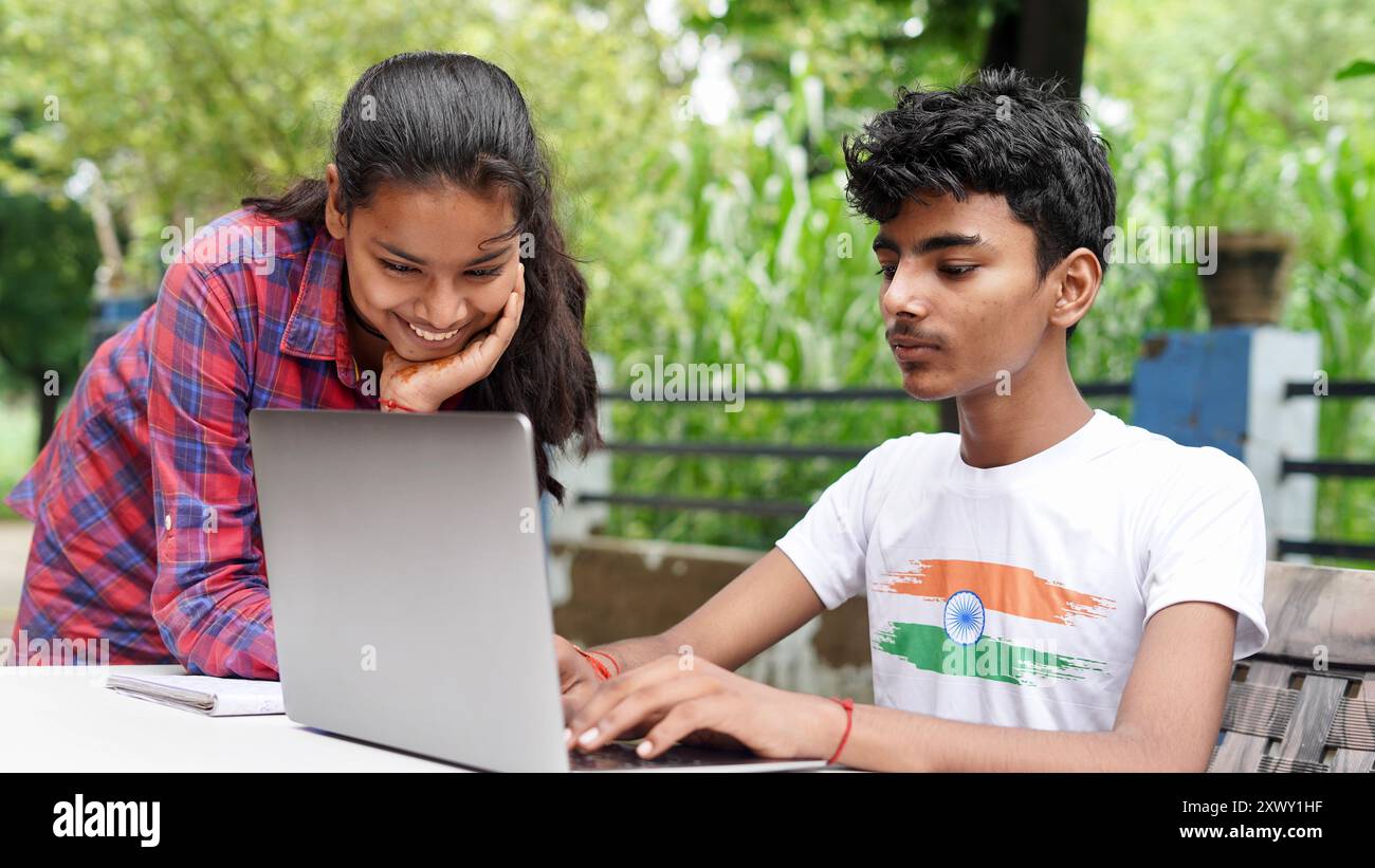 Indian village students learning online with laptop and doing homework ...