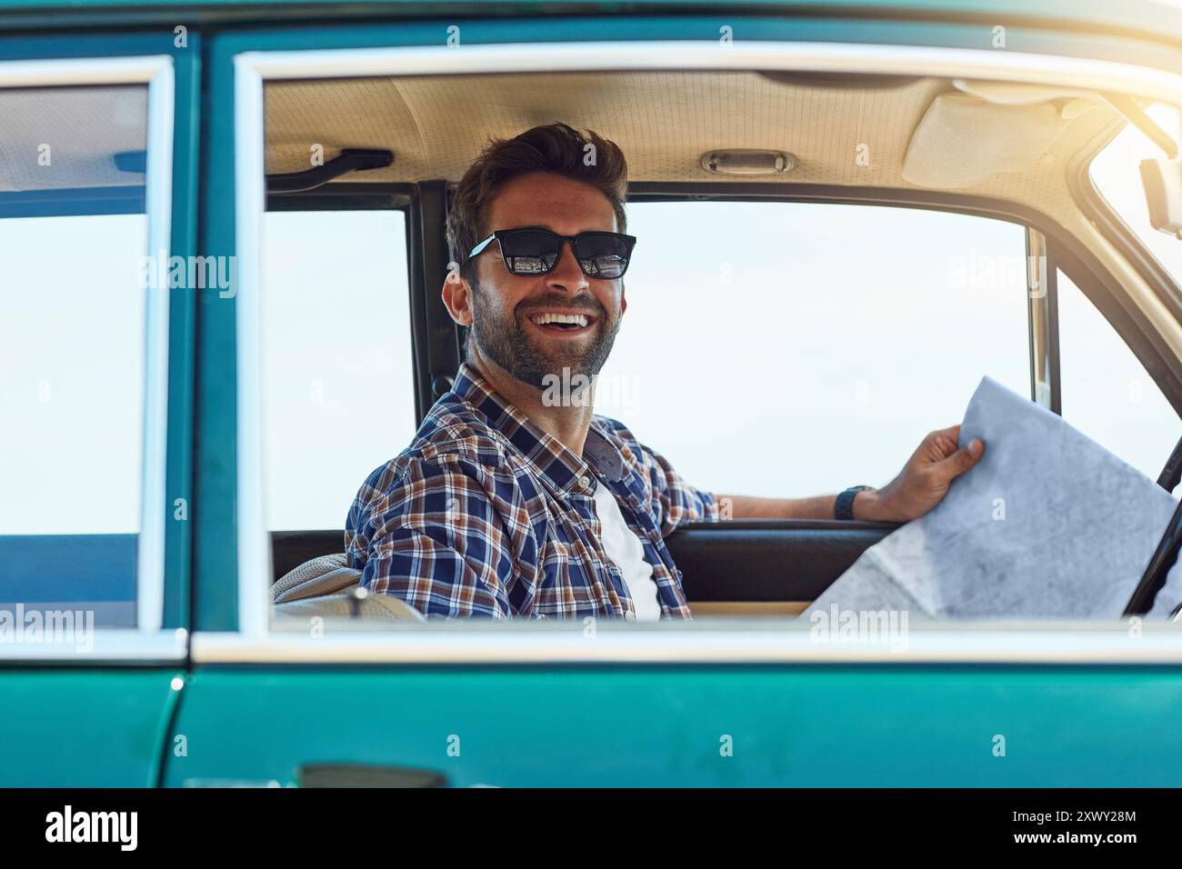 Portrait, man and driving with map on road trip for travel navigation ...