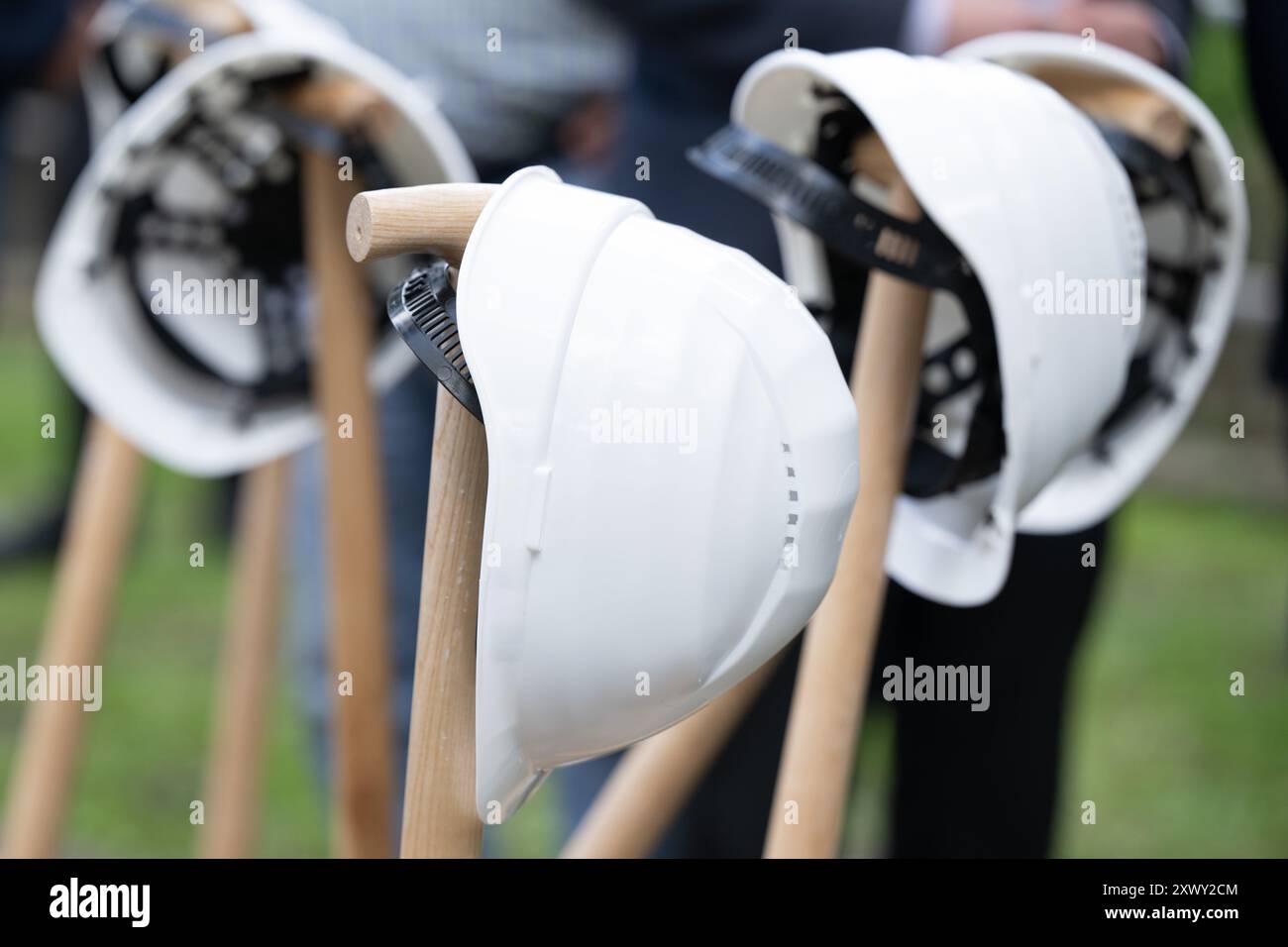 Hohnstein, Germany. 21st Aug, 2024. Construction helmets hang on the ...