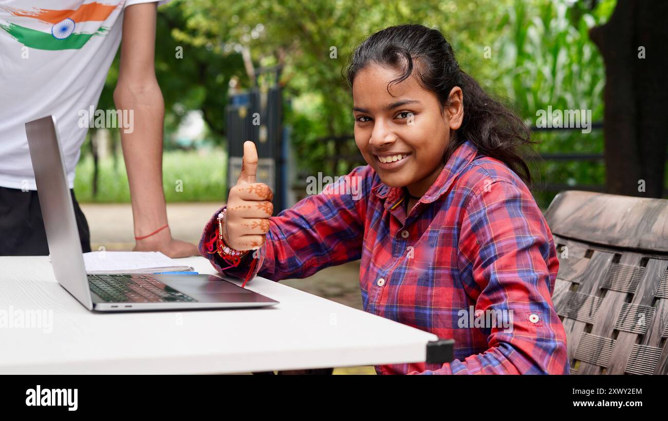 Indian village students learning online with laptop and doing homework ...