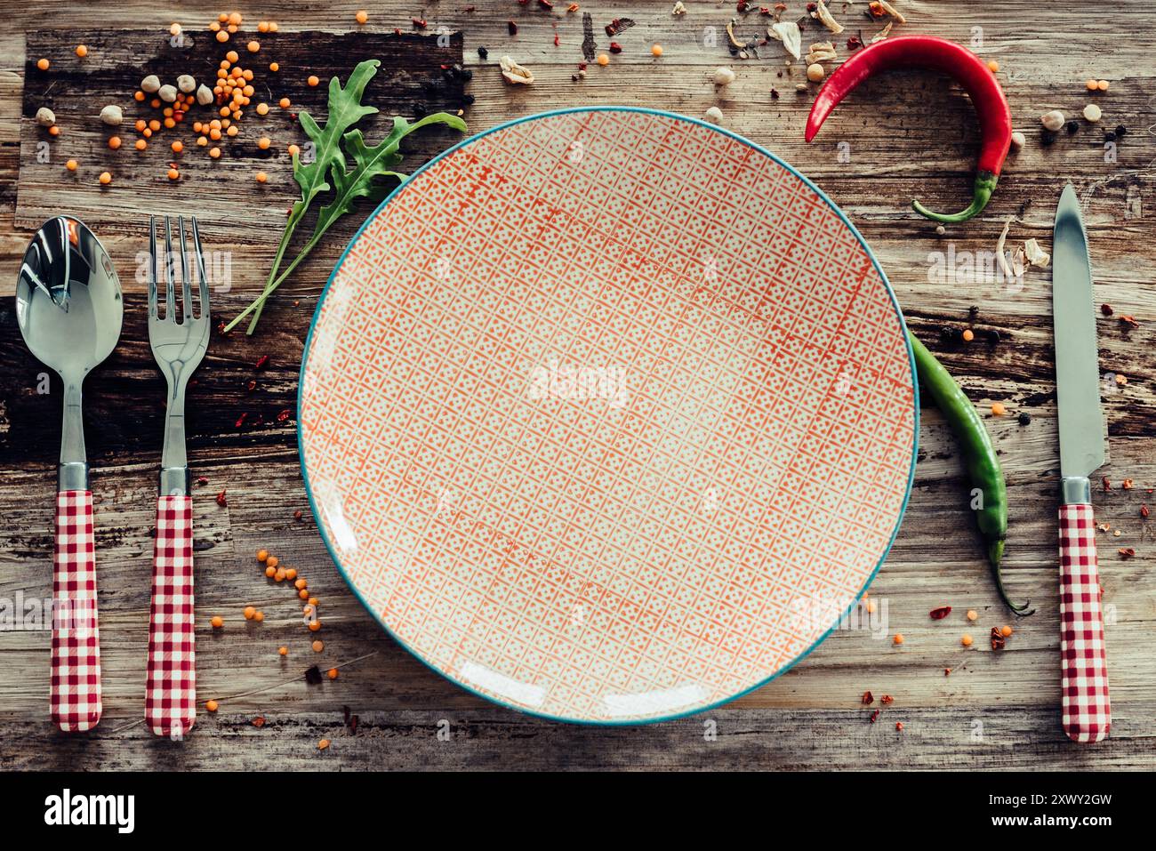Got meal? Top view of empty plate laying on the rustic wooden desk ...