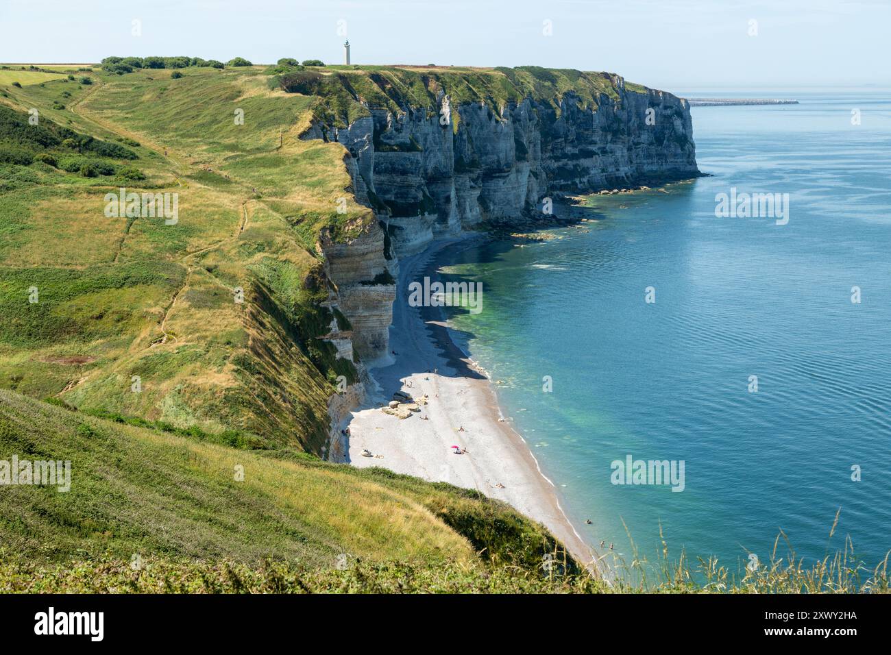 Plage du Tilleul beach near Etretat with Phare d'Antifer lighthouse in ...
