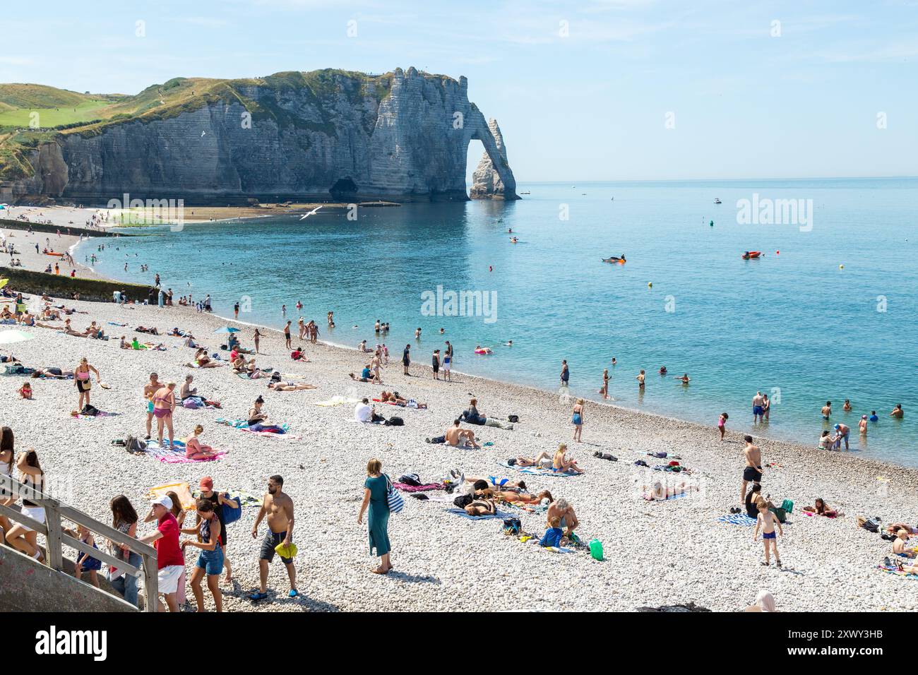 Etretat beach with the Porte d'Aval Arch and the L'Aiguille Seastack ...