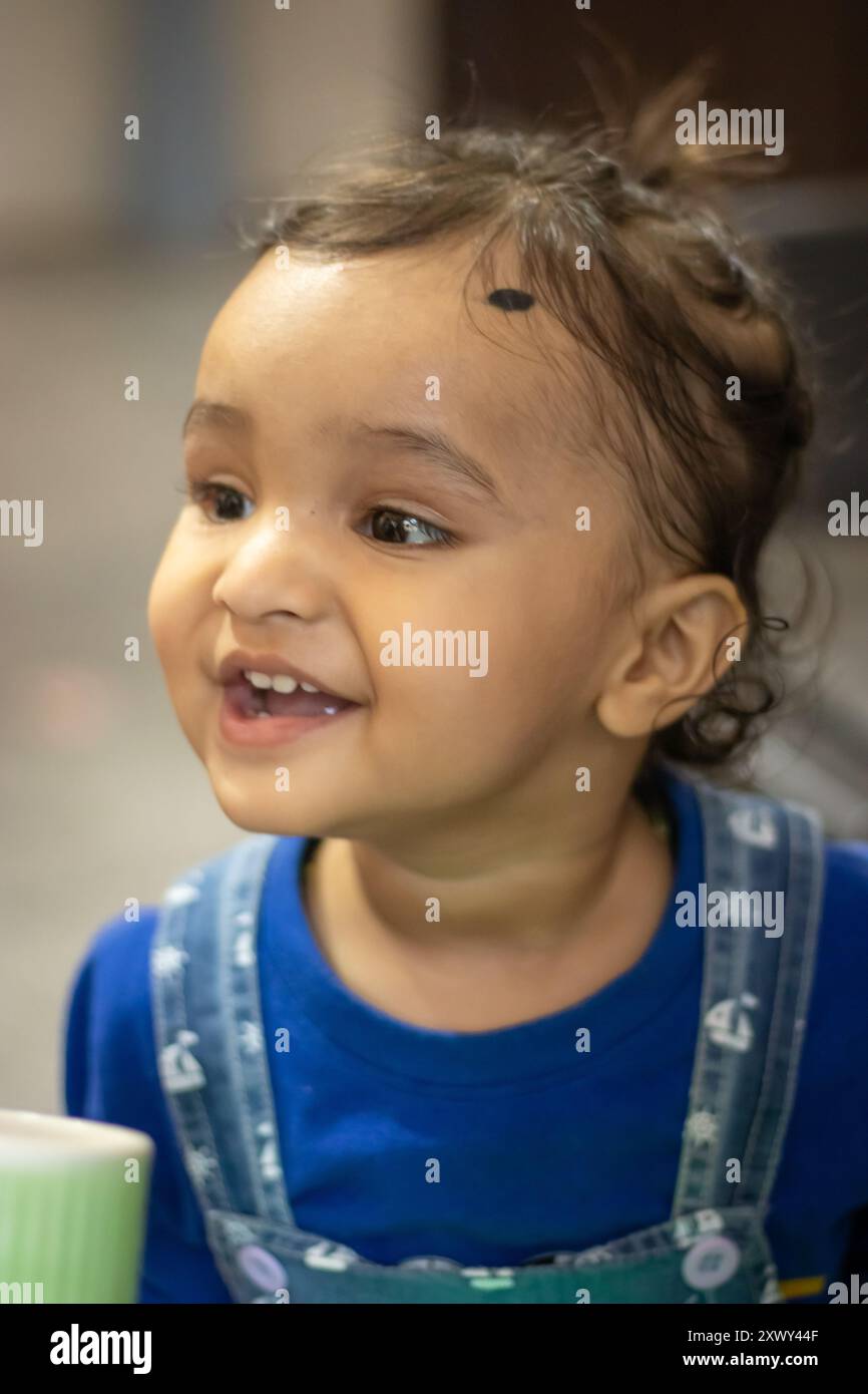 innocent toddler cute facial expression at day from flat angle Stock ...