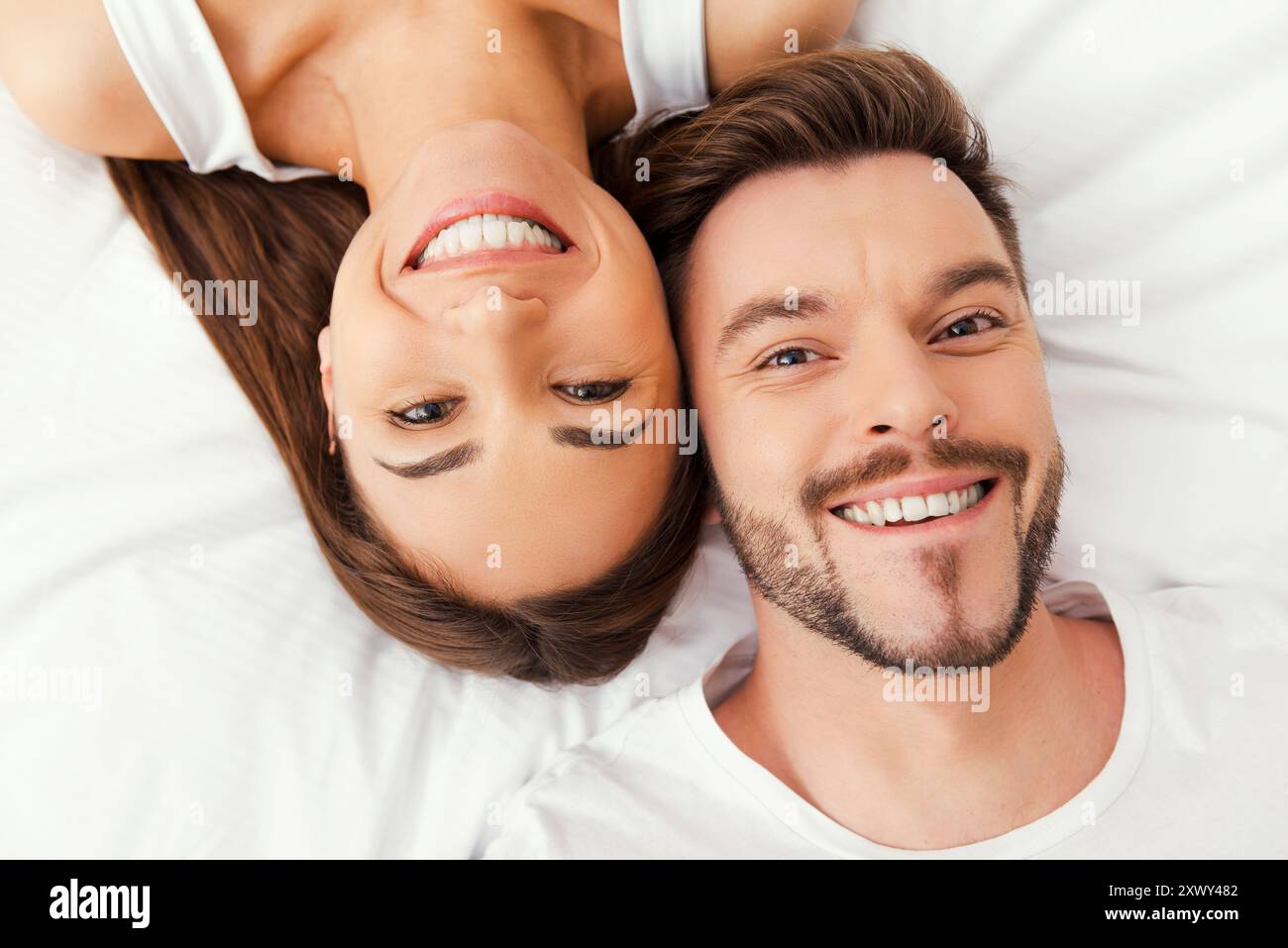 Enjoying their time together. Top view of beautiful young loving couple ...