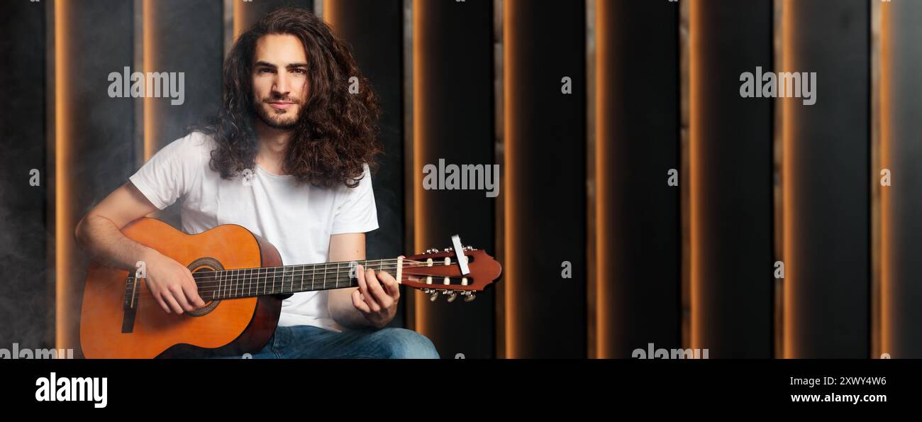 Young musician long dark hair hi-res stock photography and images - Alamy