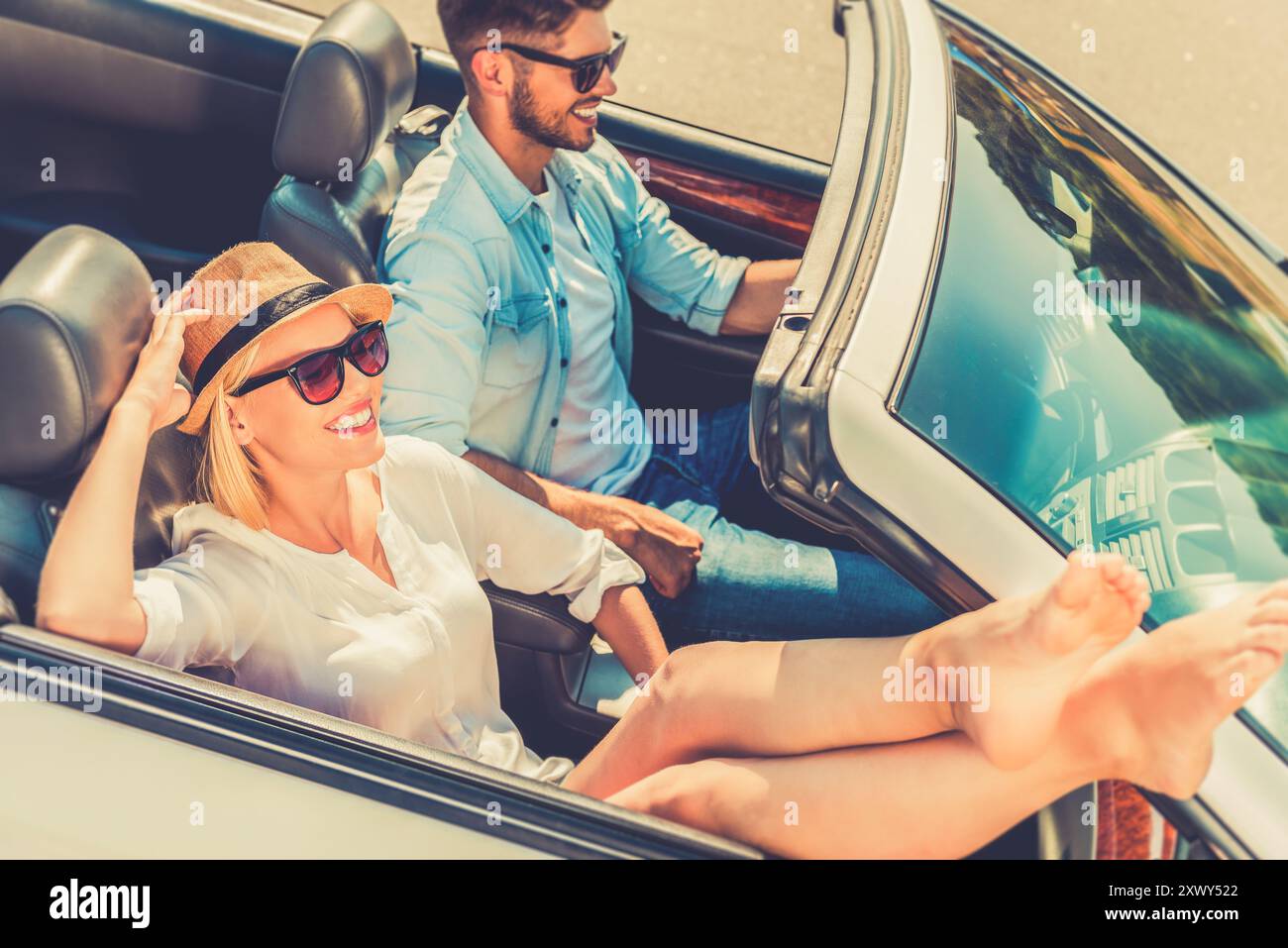 Weekend drive. Top view of smiling young woman relaxing while her ...