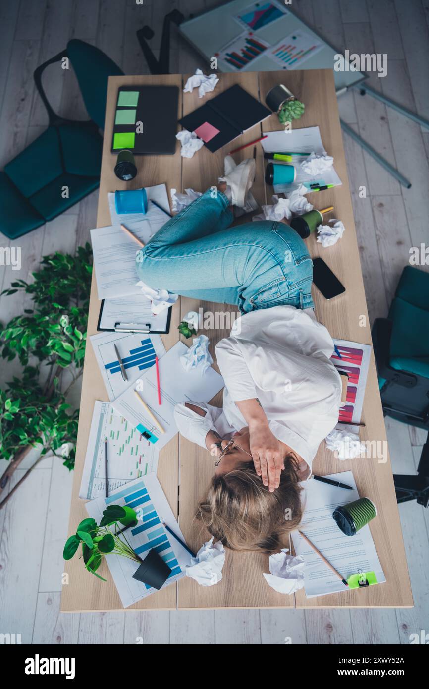 Vertical upside down high angle view photo of young corporate woman lay ...