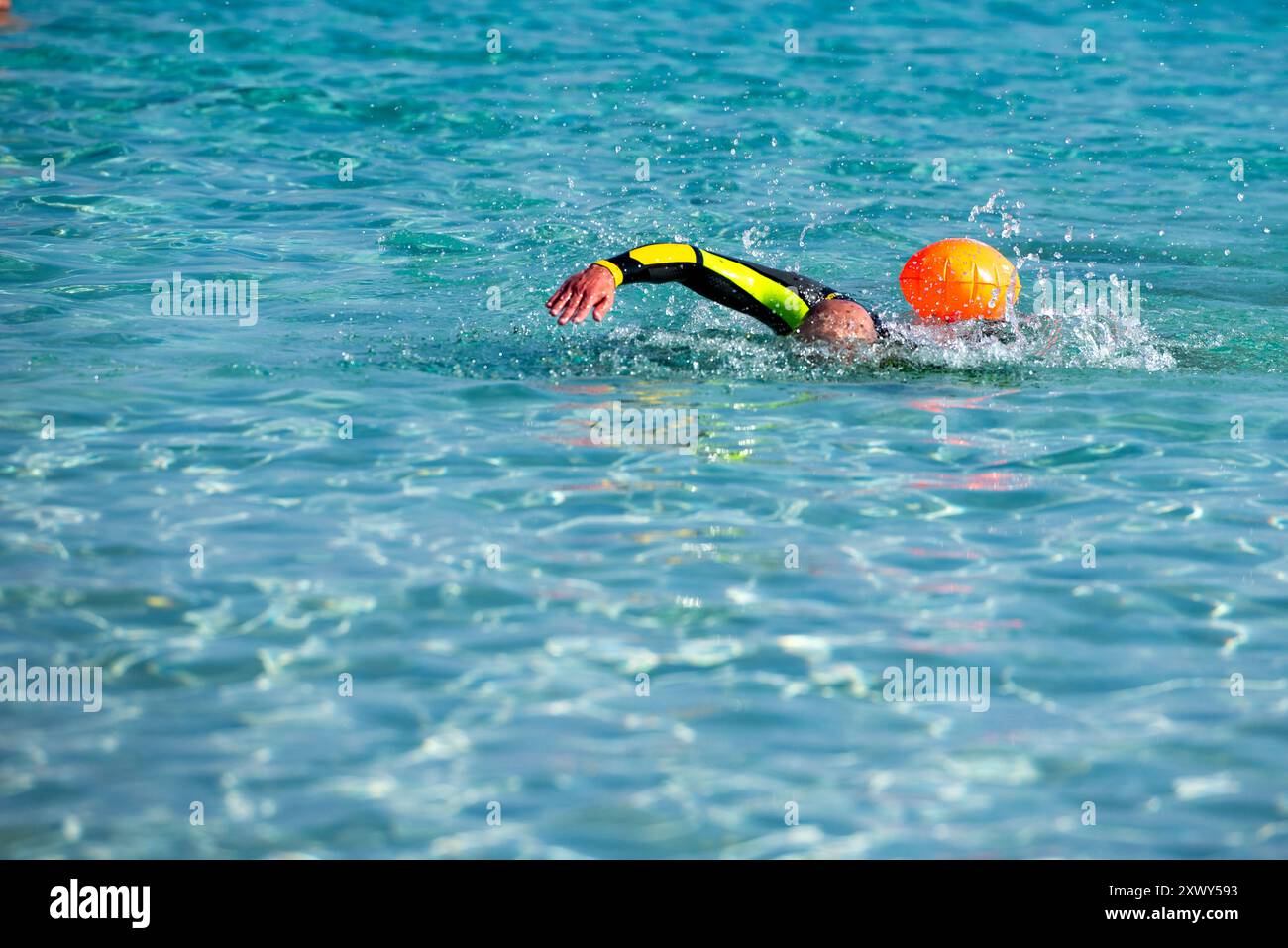 Athletes swimming free style in the sea. Swimming Racing competition ...