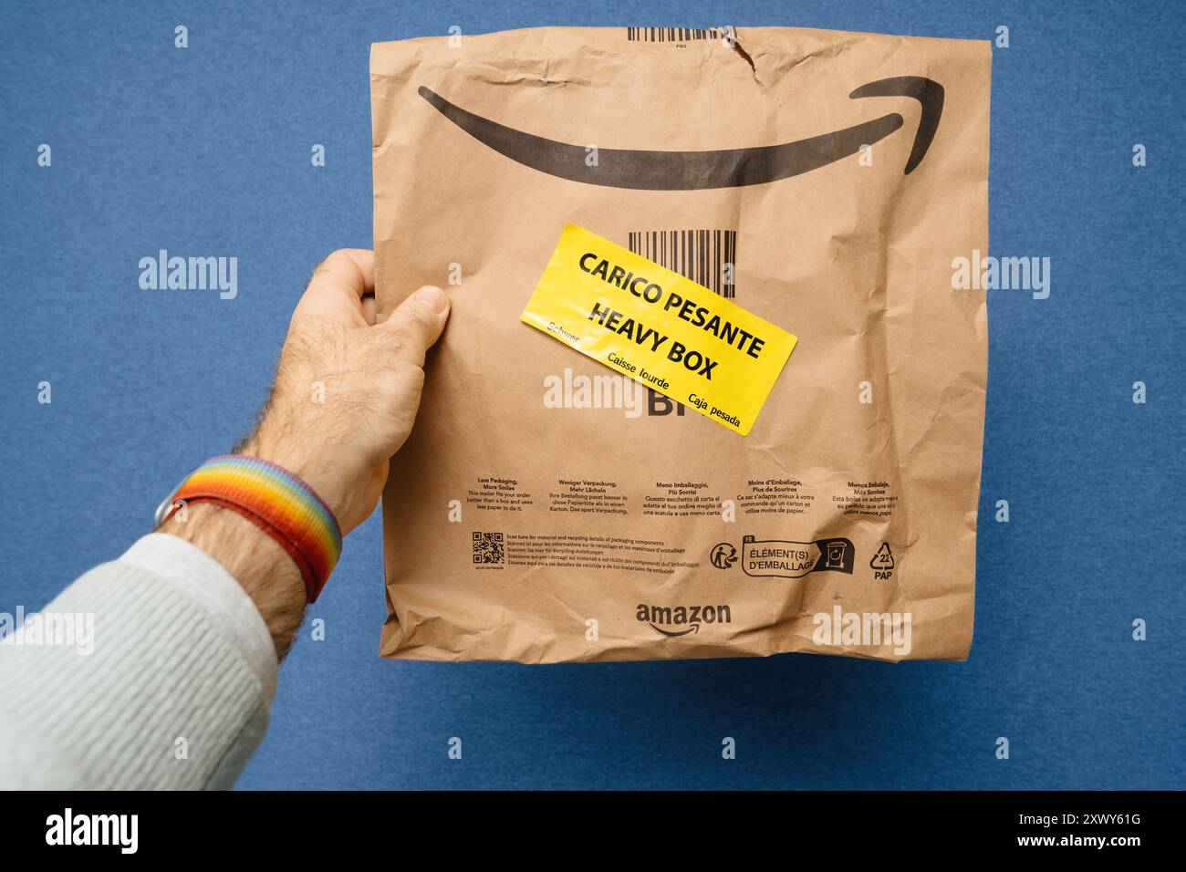 Paris, France - Dec 24, 2024: A male hand holding an Amazon Prime ...