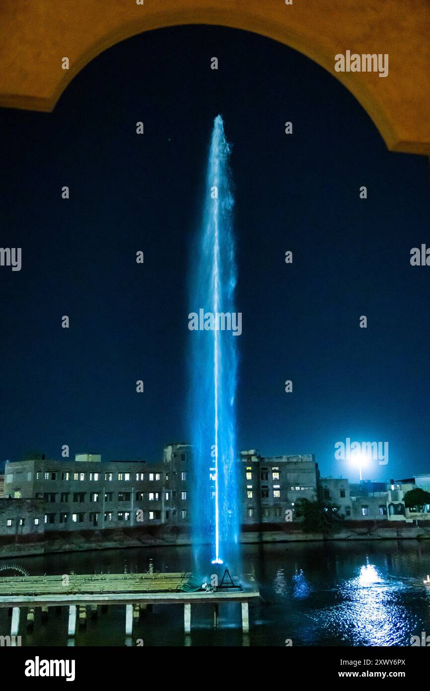 water fountain with long water throw at night Stock Photo - Alamy