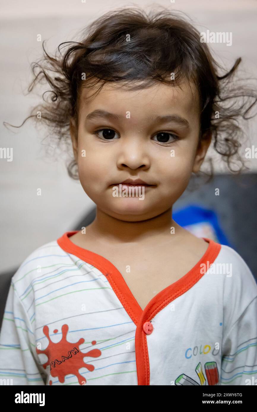 kid innocent facial expression at indoor at night Stock Photo - Alamy