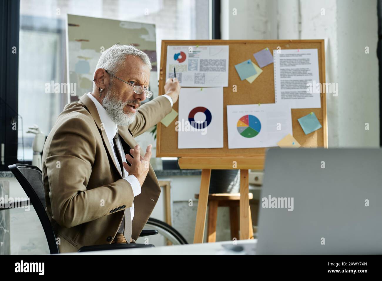 An enthusiastic teacher gestures towards a chart on a whiteboard while ...