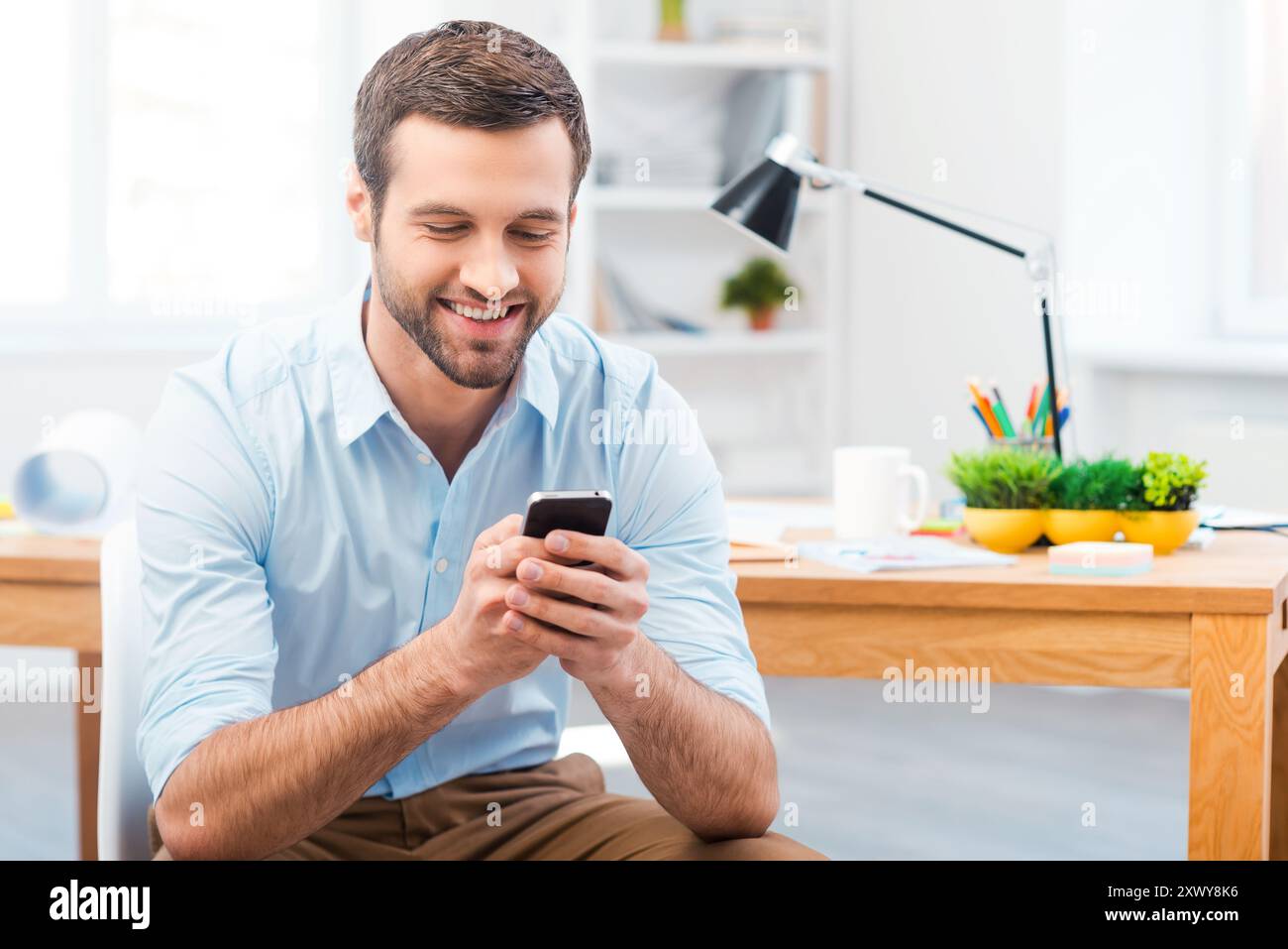 Staying in touch colleagues handsome hi-res stock photography and ...