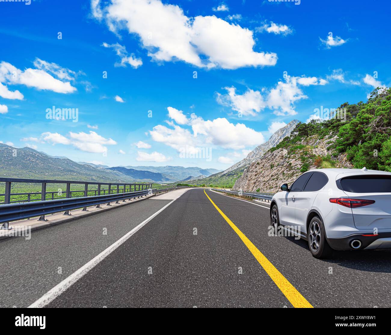 Car is driving along the highway surrounded by picturesque nature Stock ...