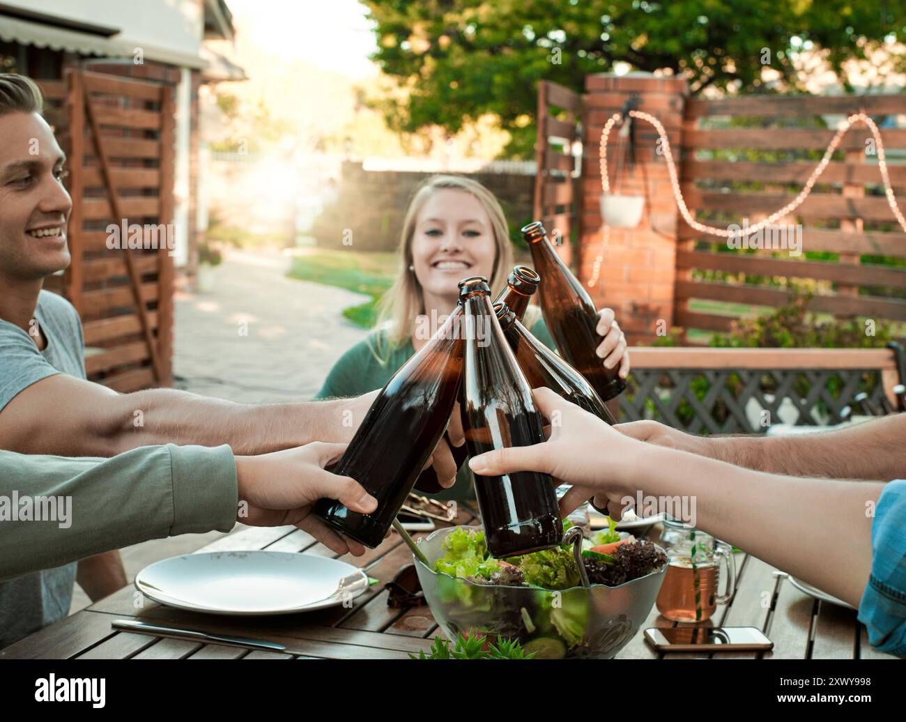 Dinner, alcohol and friends in garden for cheers, celebration and ...