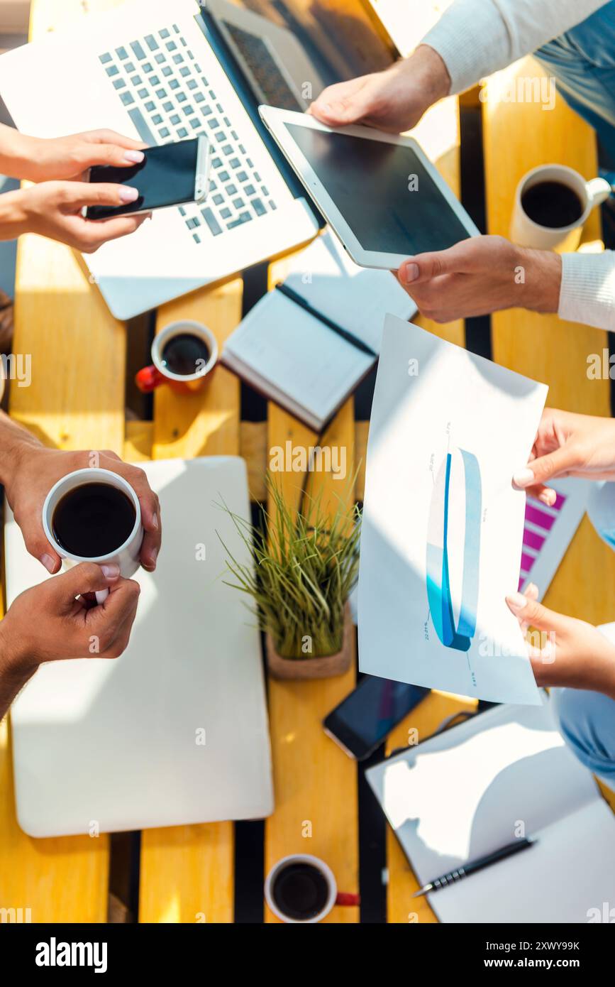 Creativity in action. Top view of four people working together while ...