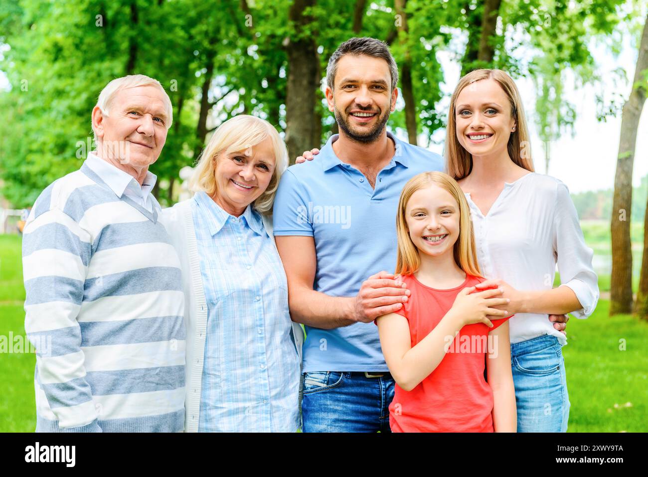 Happy to be a family. Happy family of five people bonding to each other ...