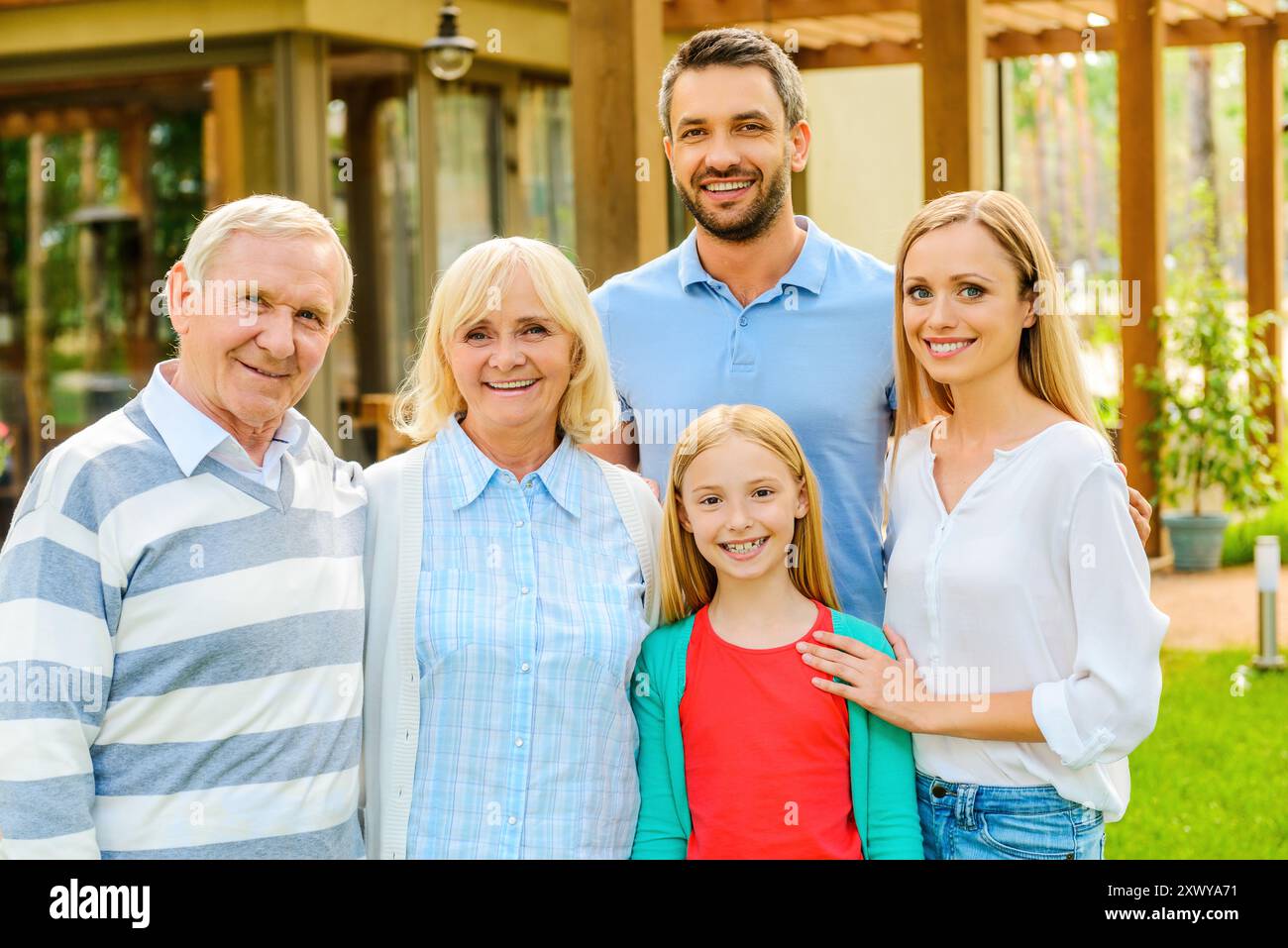 Family gathering. Happy family of five people bonding to each other and ...