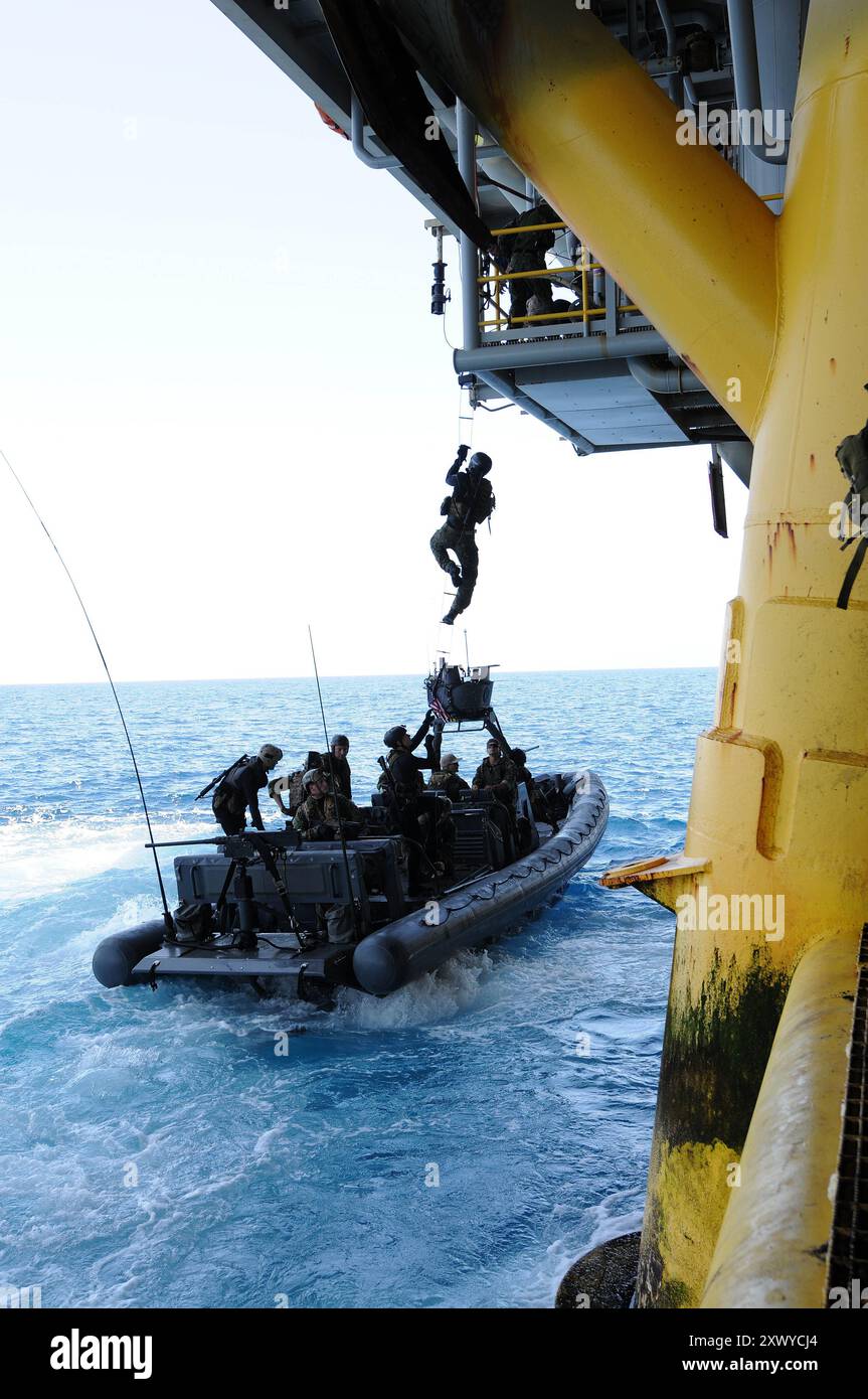 U.S. Navy SEALs train with Special Boat Team 12 on the proper ...