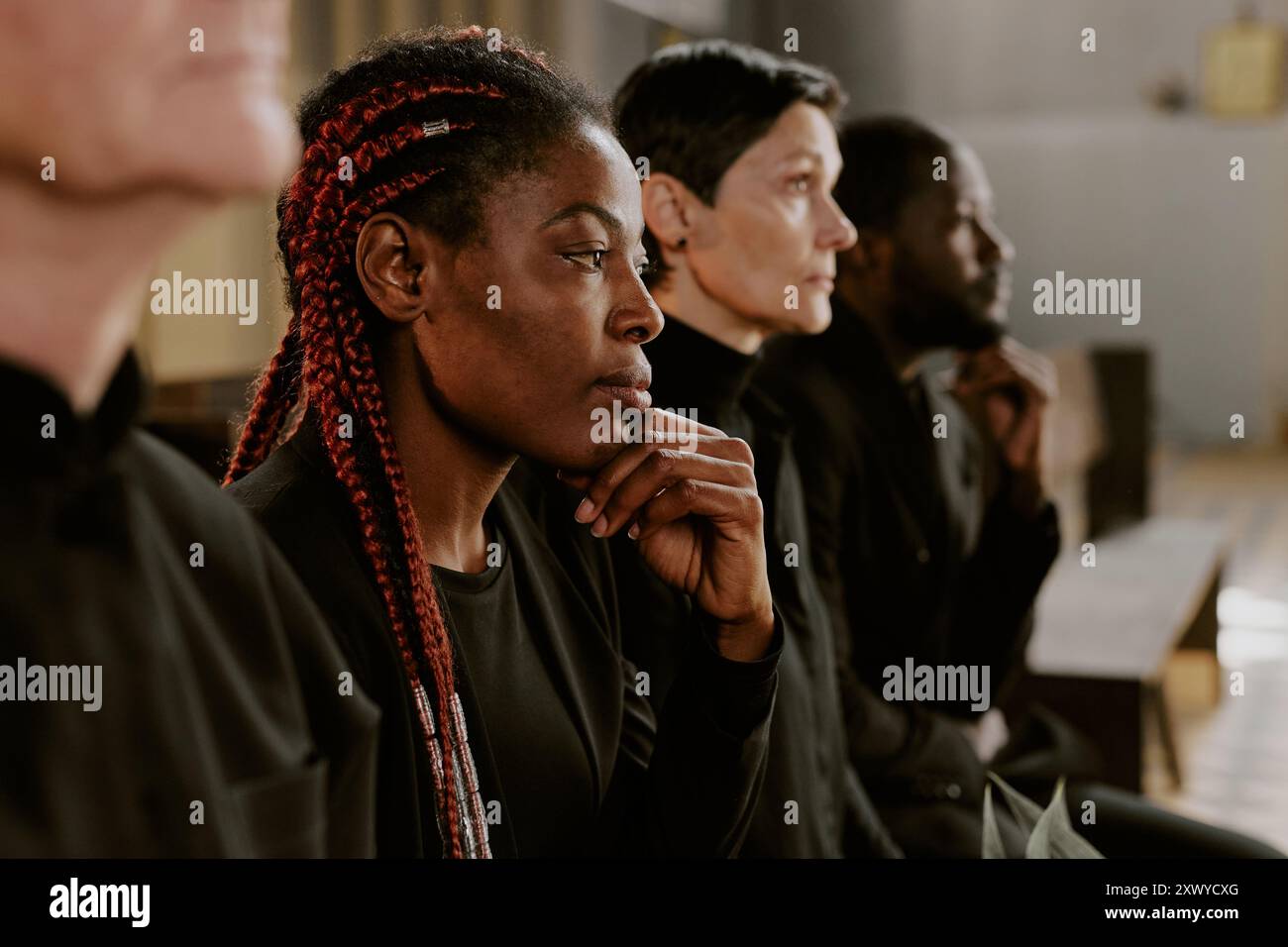 Mournful African American woman dressed in total black with eyes full ...