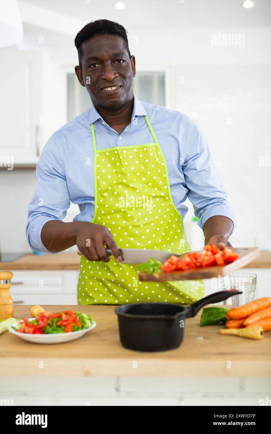 Man preparing food at home Stock Photo - Alamy