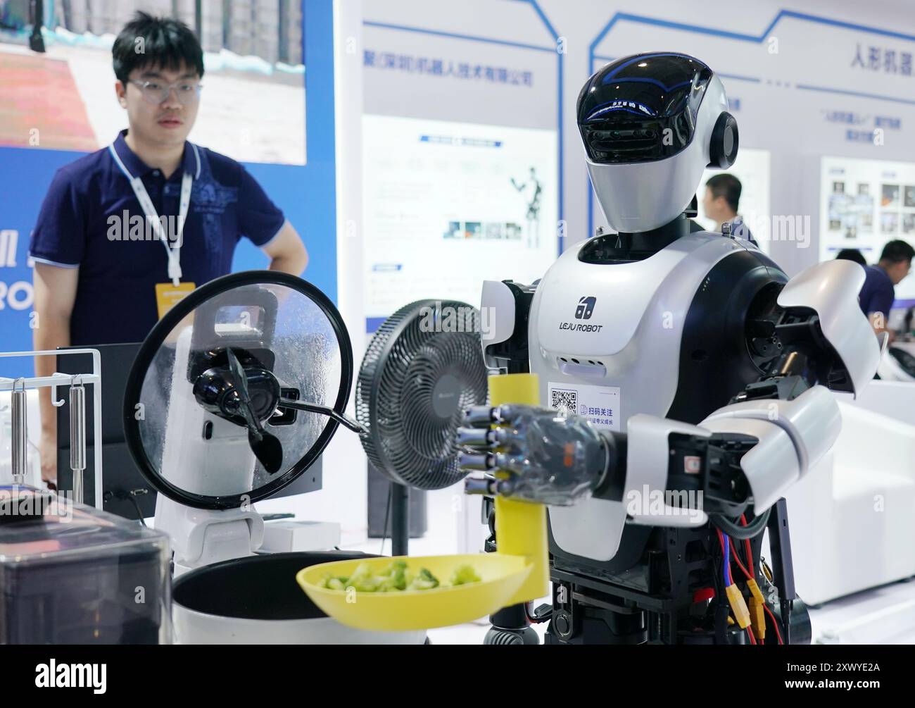 Beijing, China. 21st Aug, 2024. A humanoid robot demonstrates cooking ...