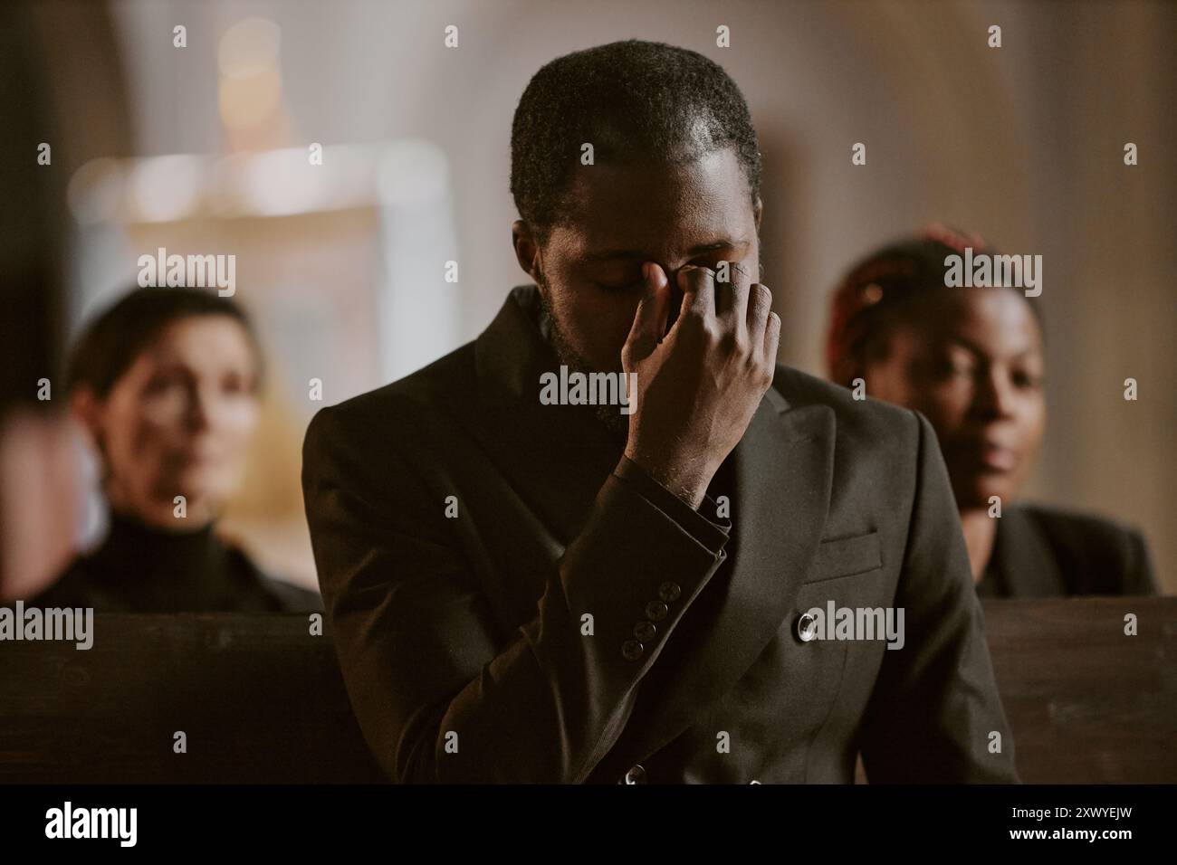 Broken inside African American man dressed in total black cant hold ...