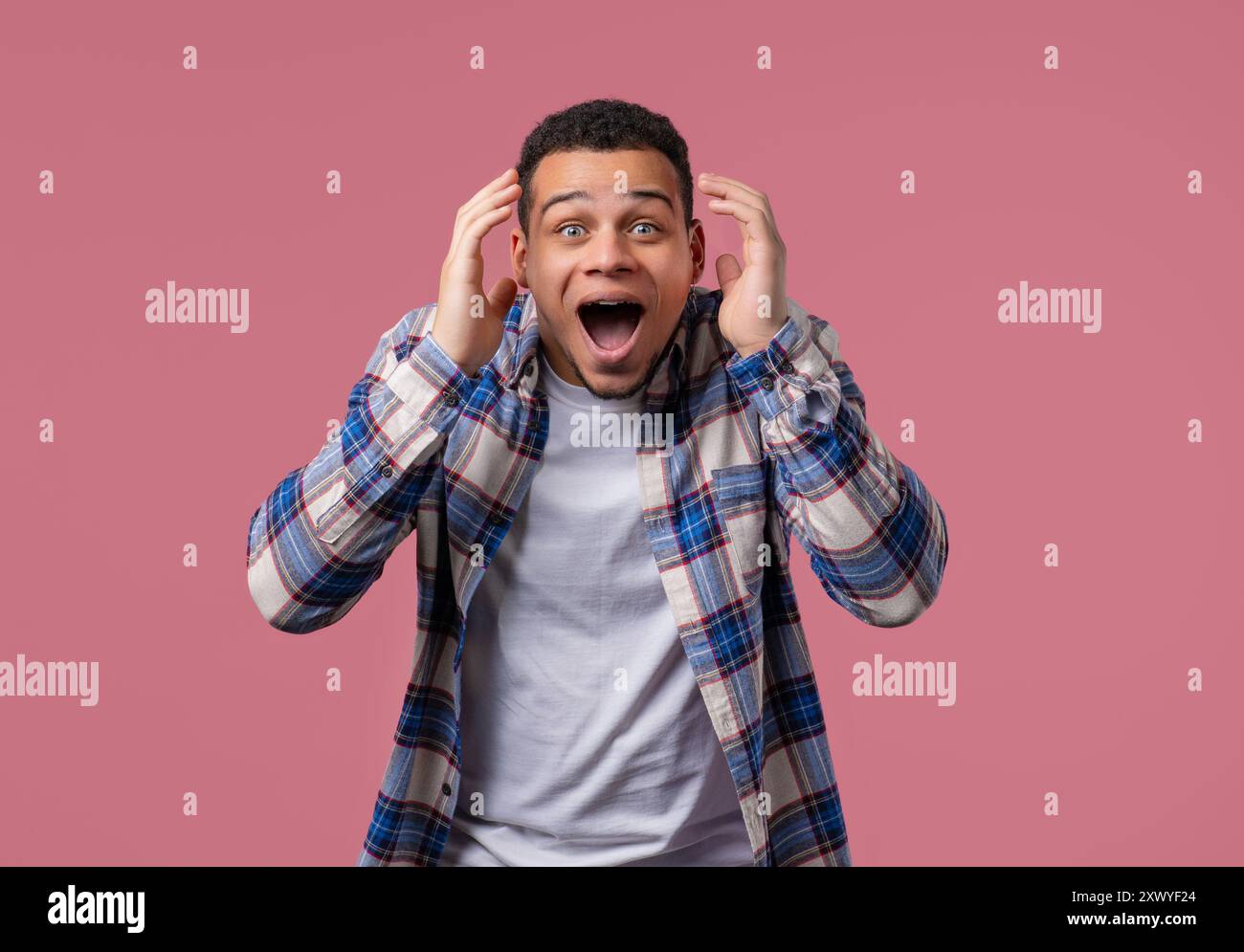 Shocked mixed race man glad, screaming WOW. Impressed guy trying get ...