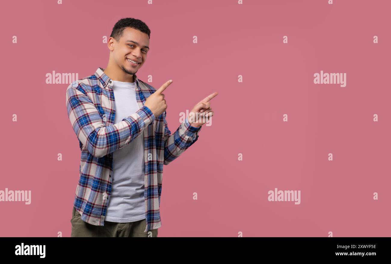 Happy promoter man presenting on workspace, mockup, promo commercial ...