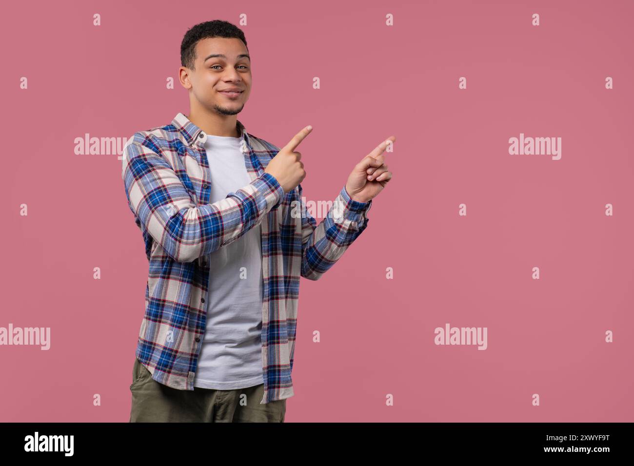 Recommending man pointing right side, copy space.Male model presenting ...