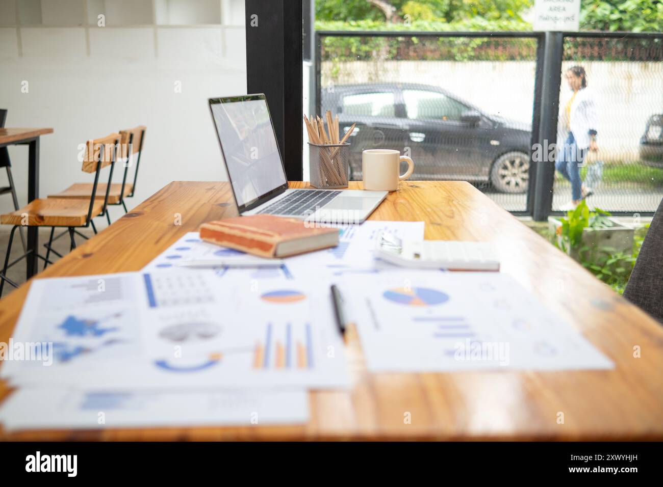 desk full of documents and tools for work in a businessman's office is ...