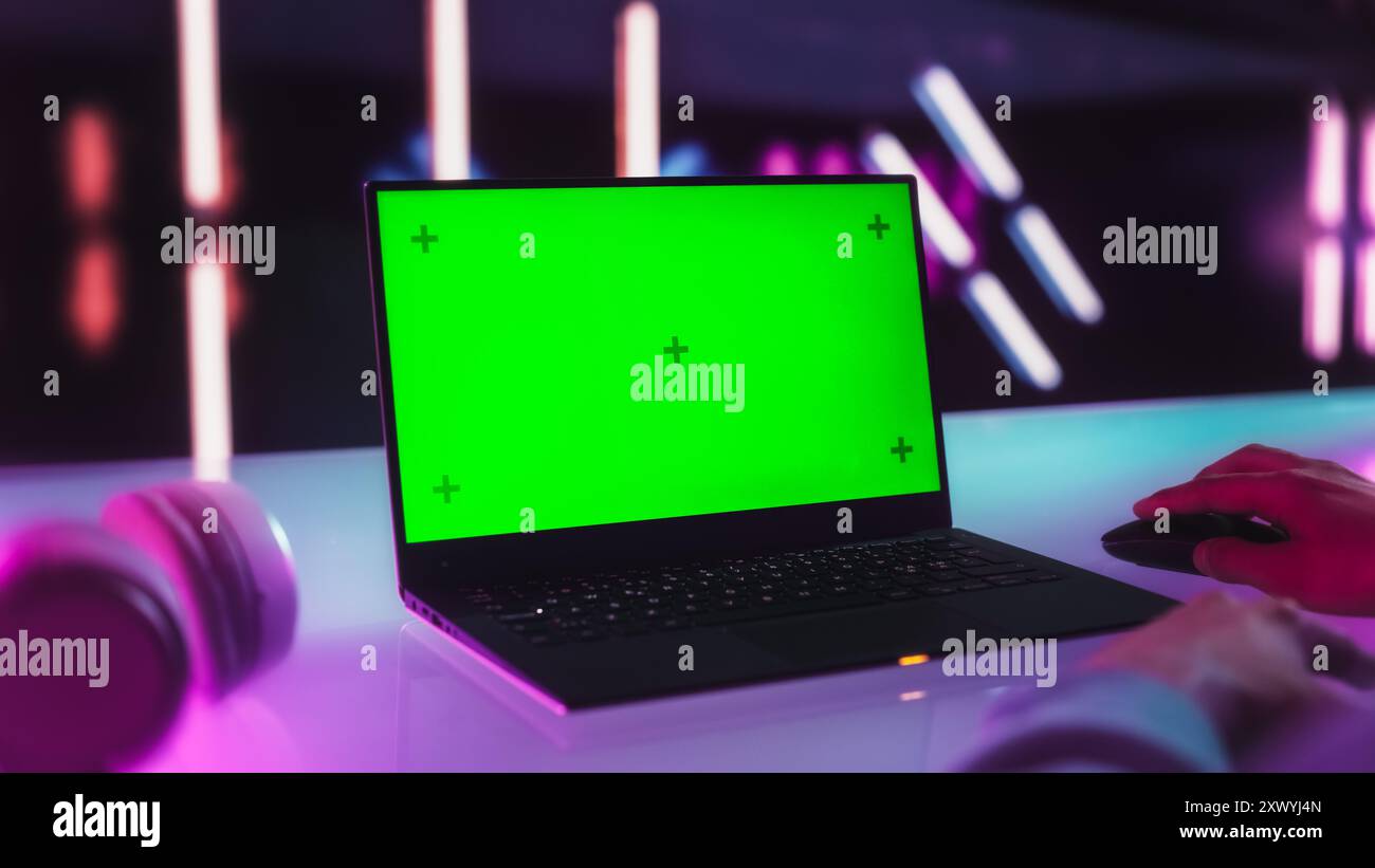 Anonymous Content Creator Using a Laptop Computer with Mock Up Green ...