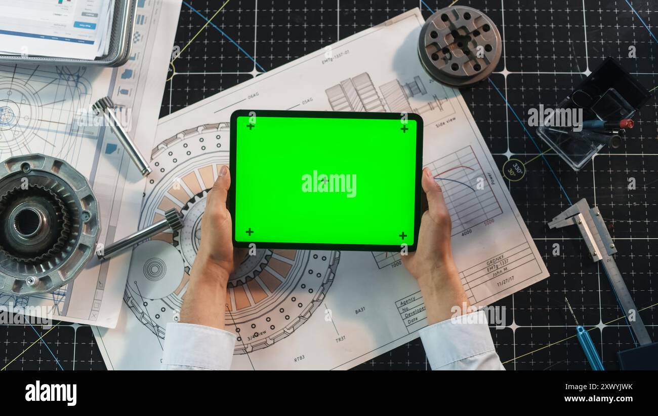 Specialist hands holding green screen hi-res stock photography and ...