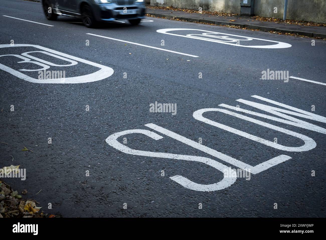 Slow down speed on 30 Stock Photo - Alamy