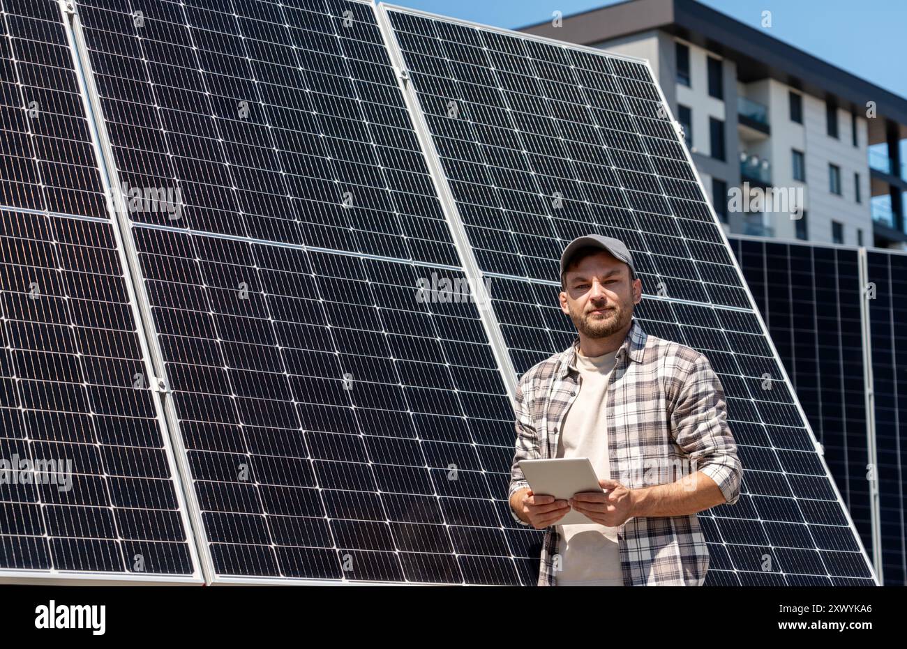 Production, installation and maintenance of solar panels. Man with ...
