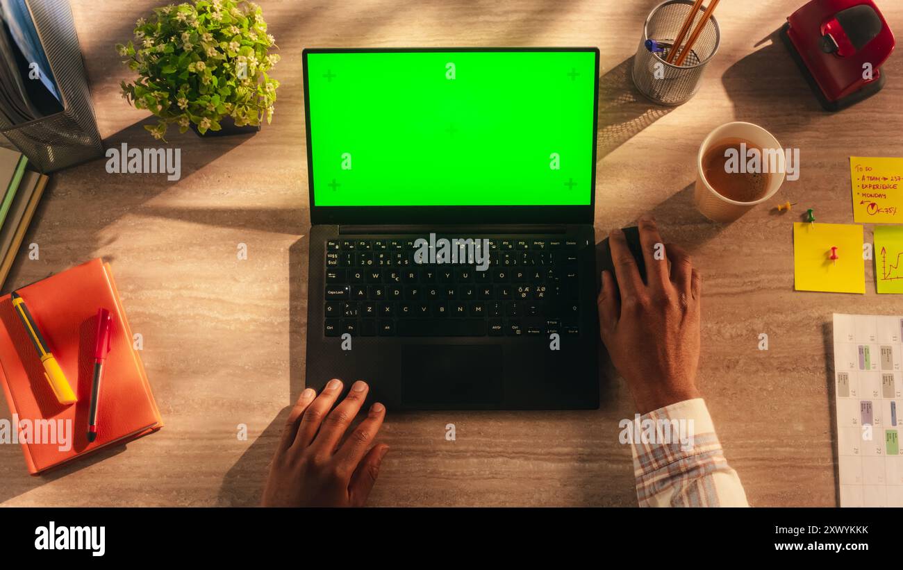 Anonymous African Manager Typing on a Laptop with Mock-Up Green Screen ...
