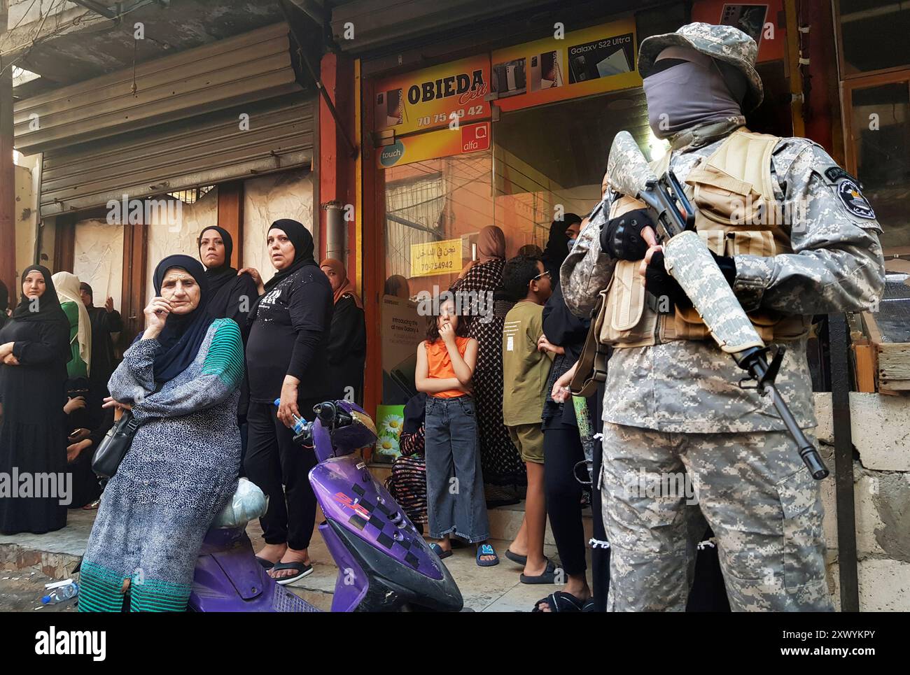 A Palestinian Fatah fighter from Al-Aqsa Martyrs' Brigades, stand guard ...