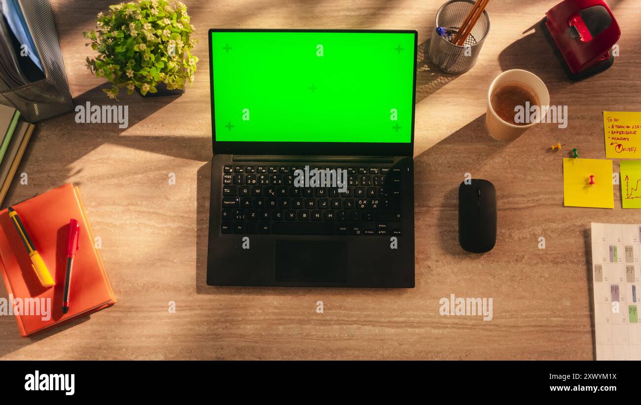 Laptop Computer On the Home Office Table with Mock Up Green Screen ...