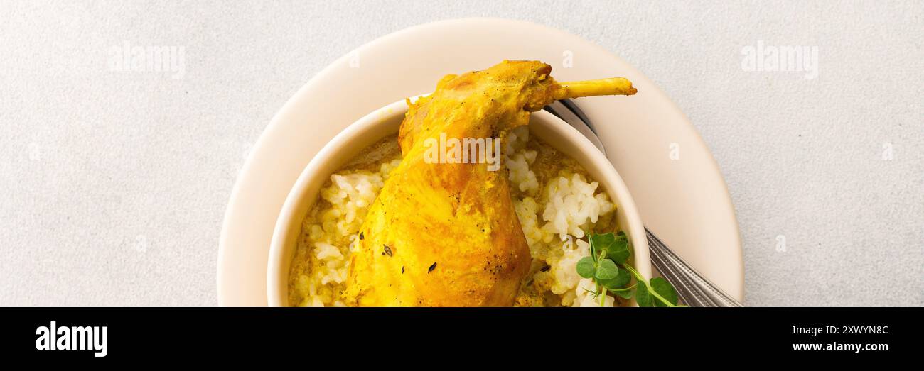 Stewed rabbit with rice, served table with food, delicious hearty lunch ...