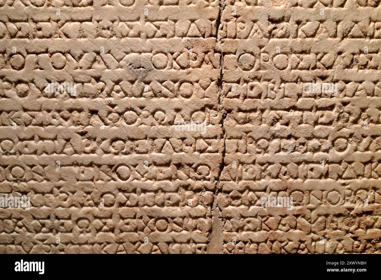 Ancient Greek inscription carved into a stone tablet, featuring dense ...