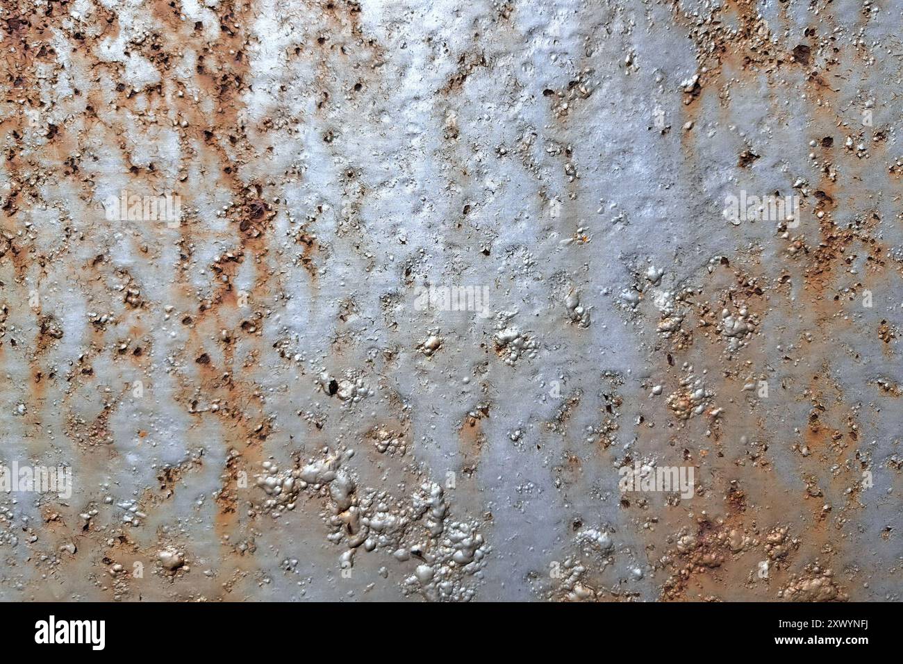 The surface is covered with cracked silver paint and rust. Backgrounds ...