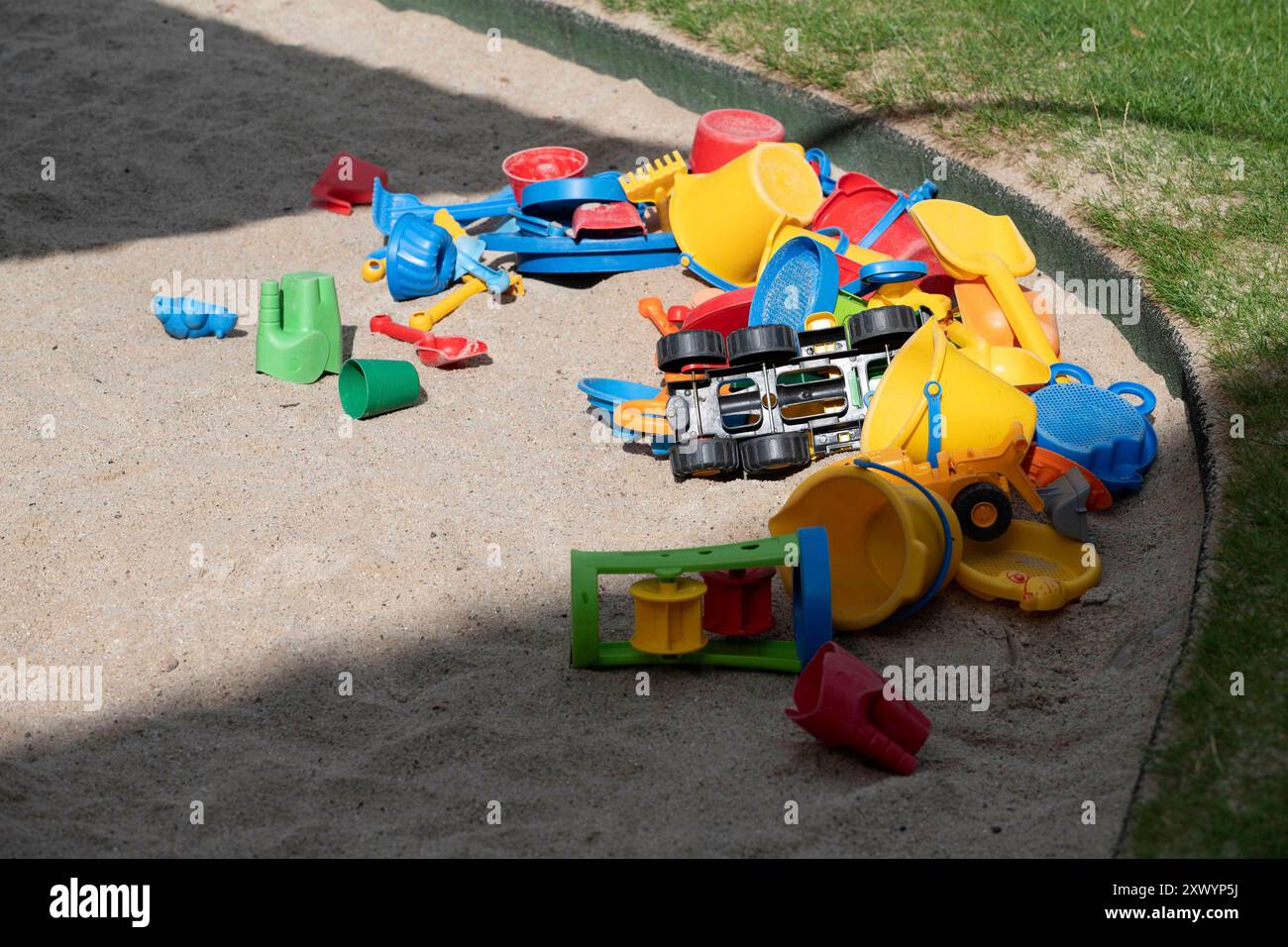 Toys lie in a sandpit, general, feature, marginal motif, symbolic photo ...