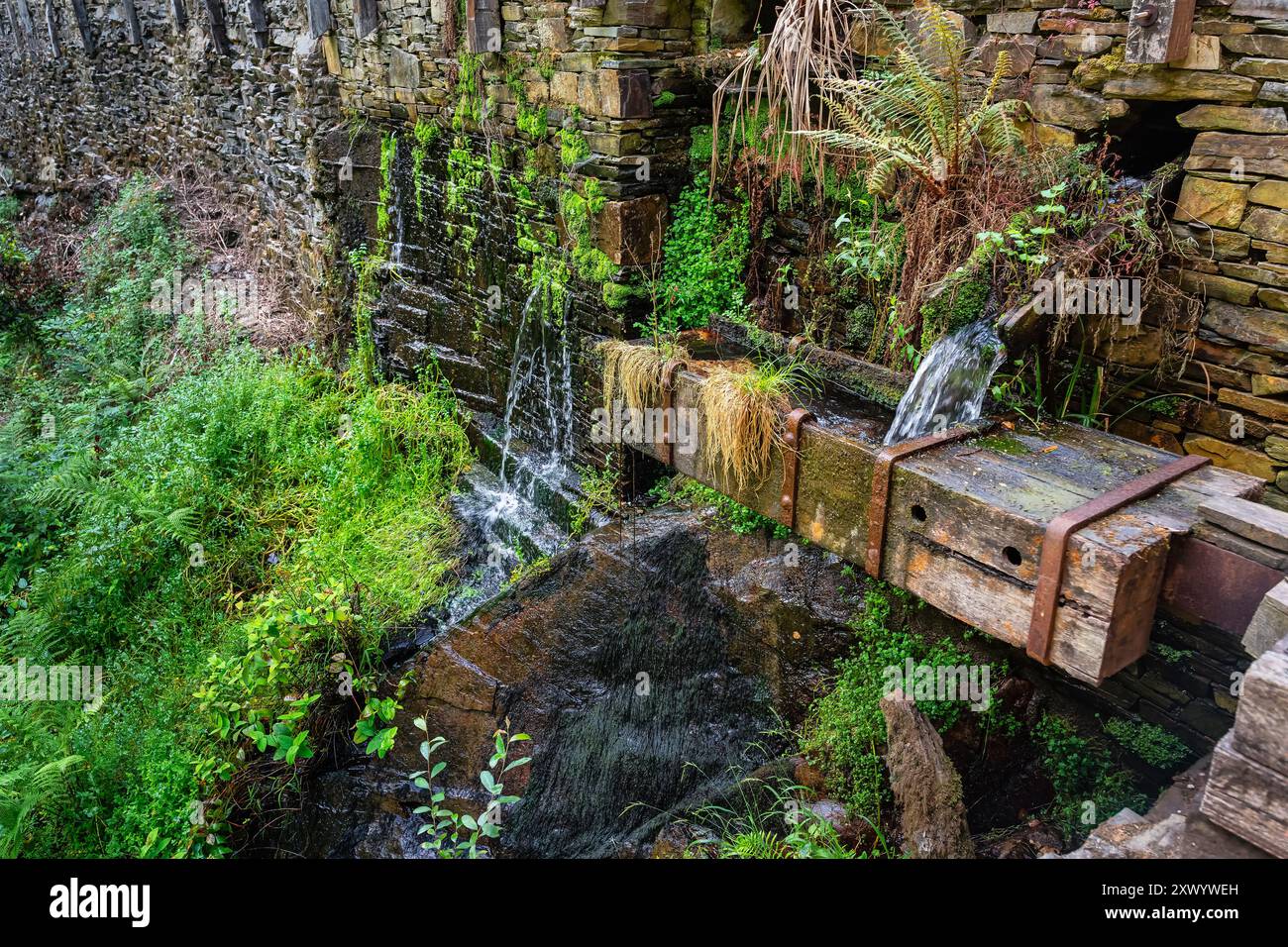 Old water mill system with wood to grind the grain of the harvest ...