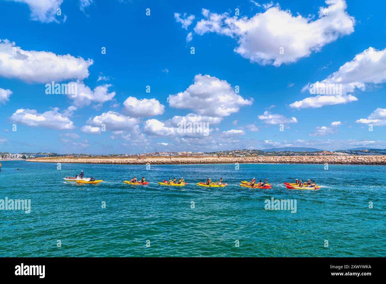 Lagos seafront Portugal people and water sport activities in kayak ...
