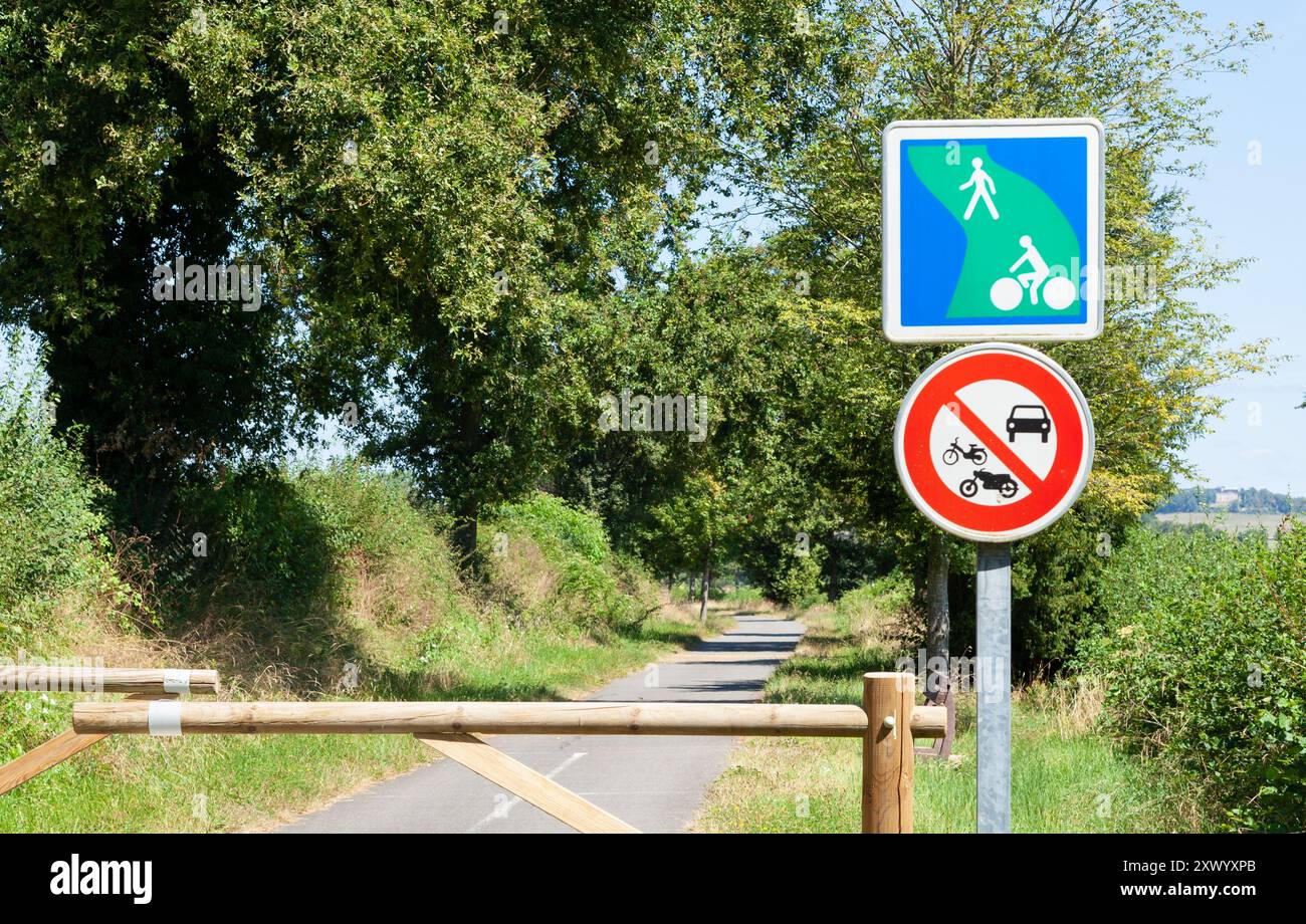 Road signs on the background of the road and nature Stock Photo - Alamy