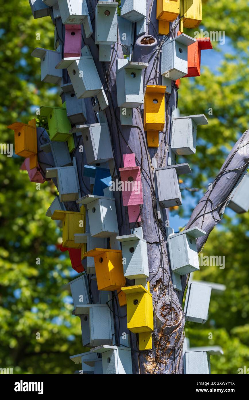 tree decorated with hundreds of colorful birdhouses in the esplanade ...