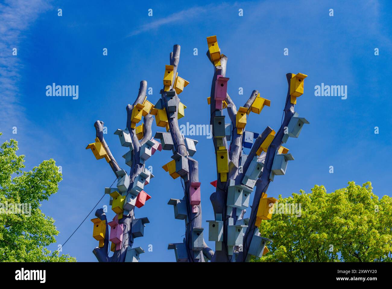 tree decorated with hundreds of colorful birdhouses in the esplanade ...